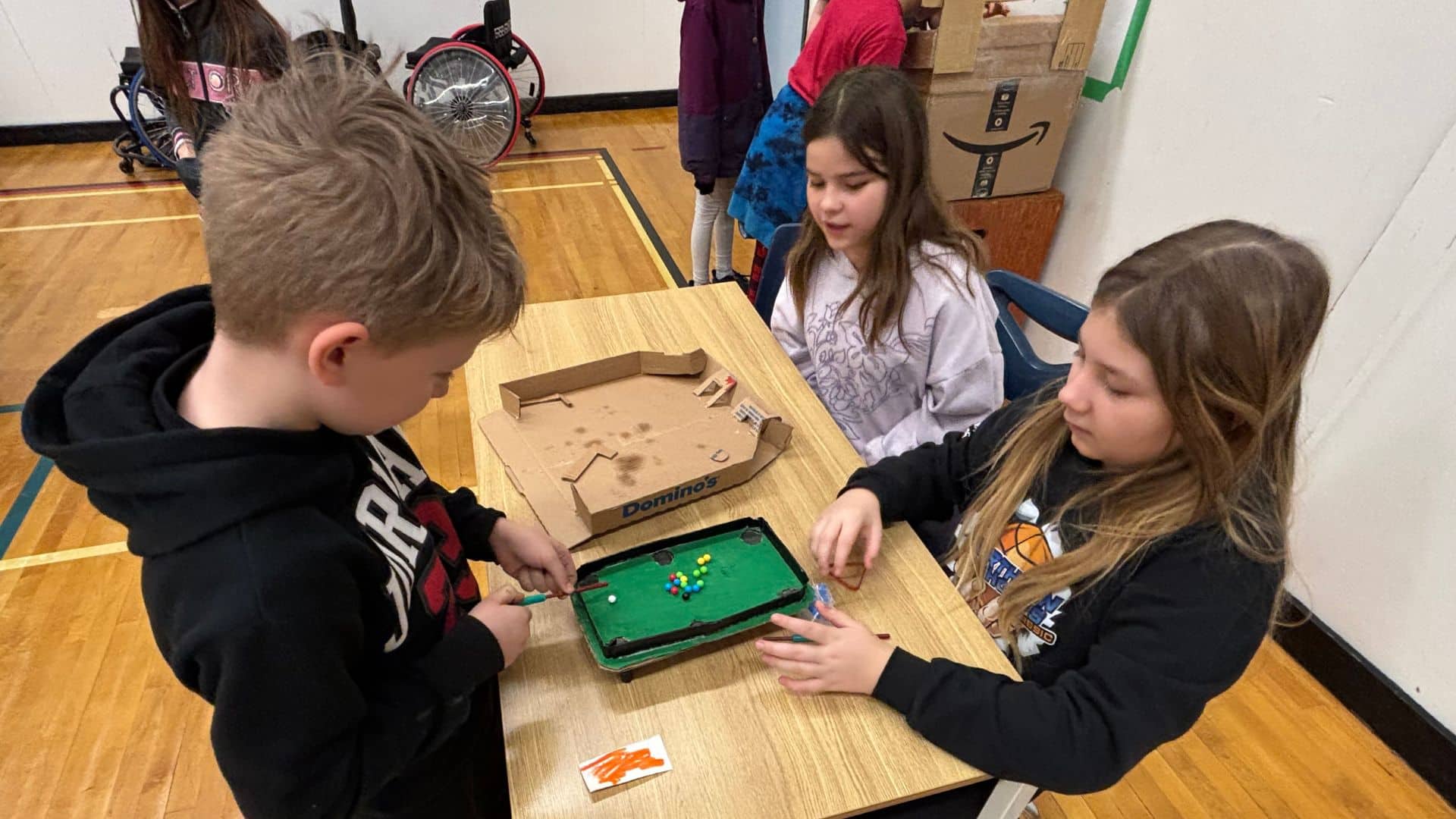 Robert Ogilvie Elementary kids create cardboard arcade games